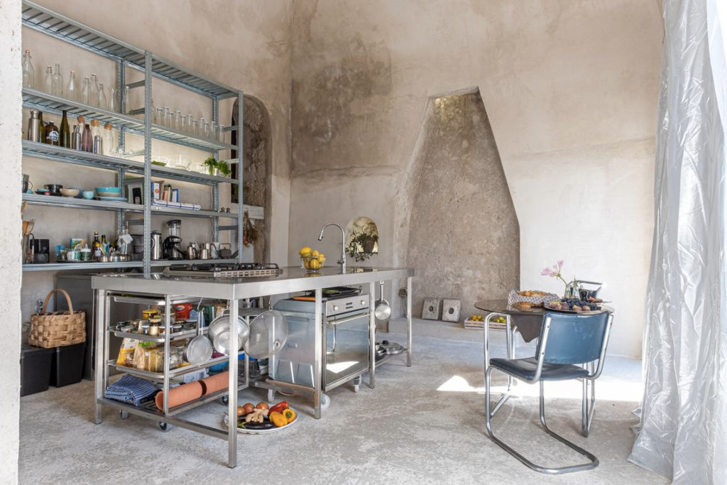 A converted olive oil factory with raw interiors is for sale in Italy ...