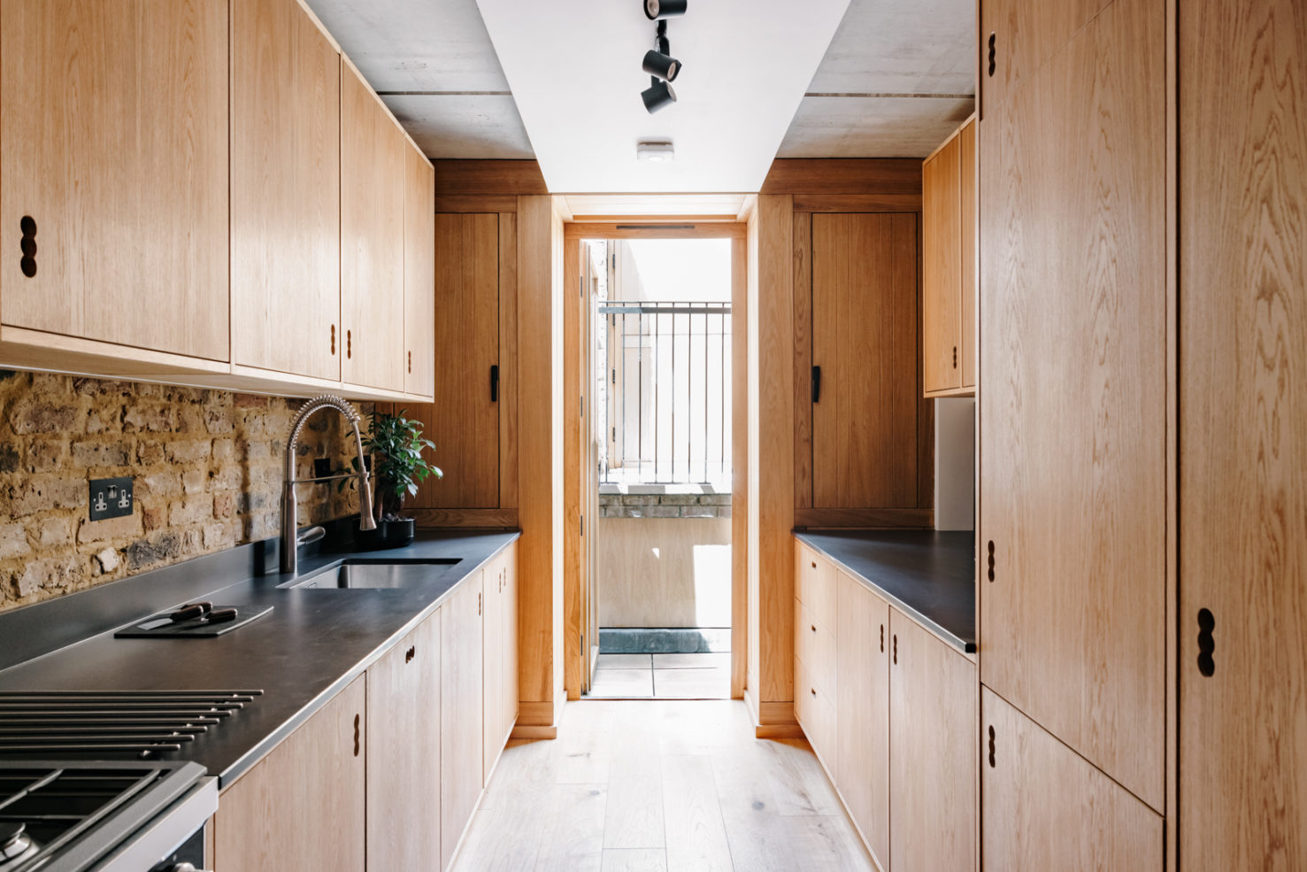 Satish Jassal Architects transforms London garage plot into a secluded ...