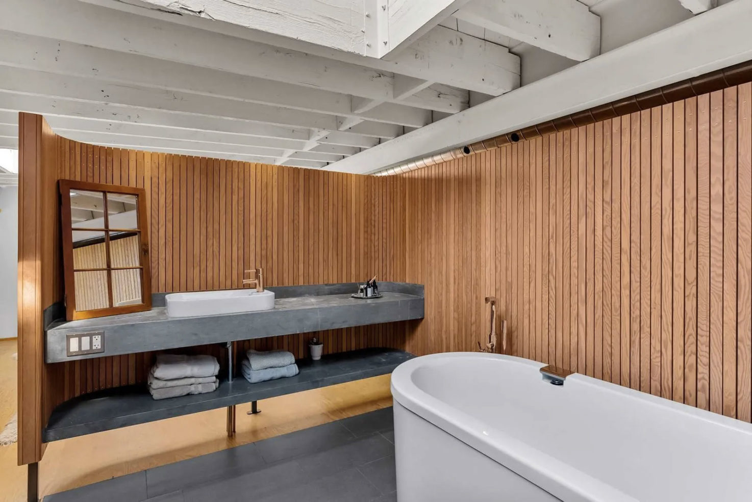 Peek inside a Toronto train-track loft with industrial proportions ...