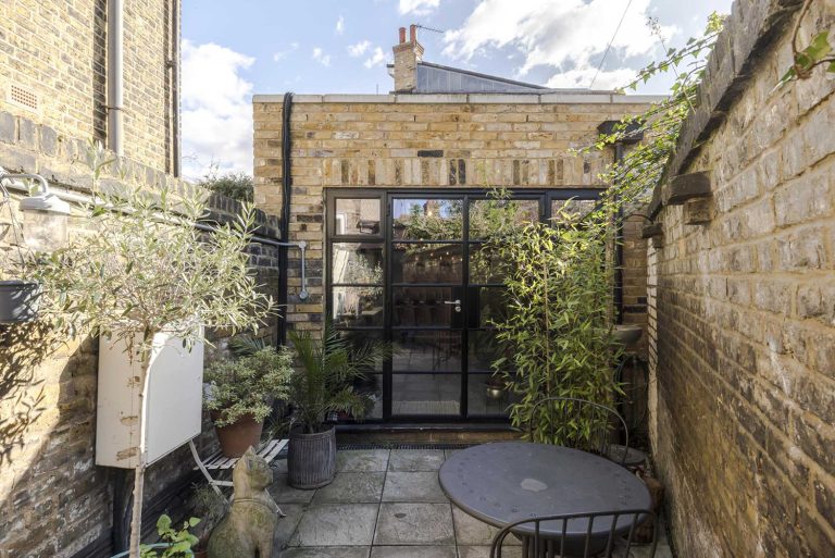 Converted coach house is a light-filled industrial living space in ...