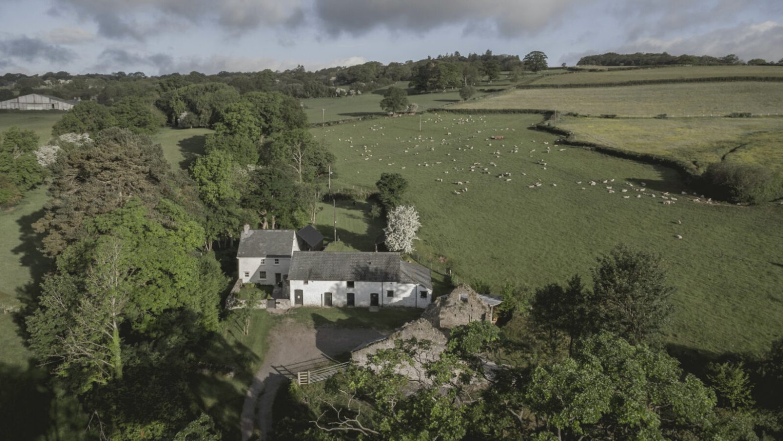 An architect-designed farmhouse conversion in rural Wales lists for ...