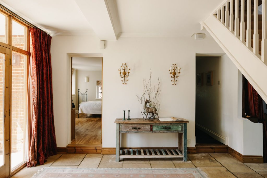 This converted coach house sleeps 10 under original wood beams - The Spaces