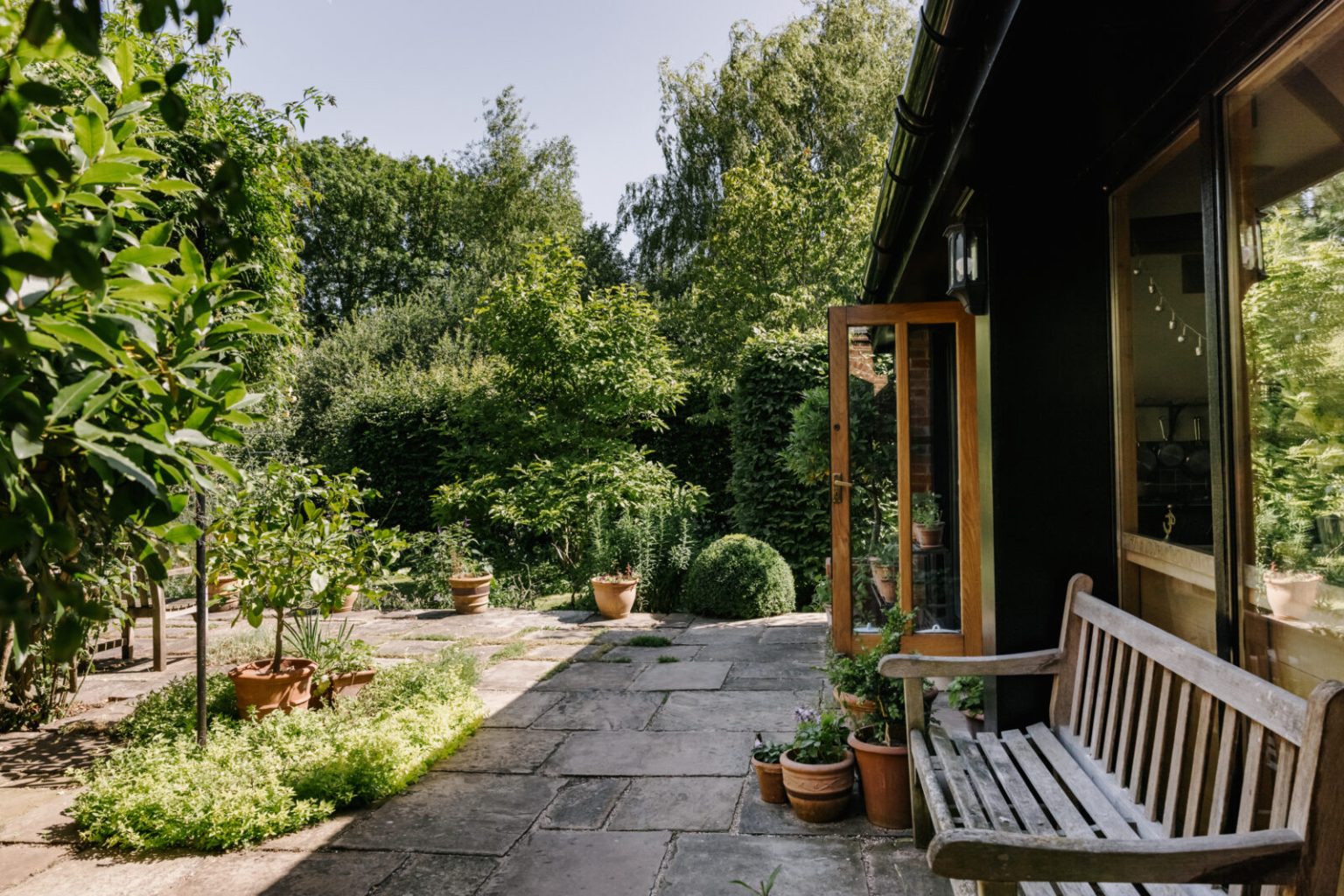 This converted coach house sleeps 10 under original wood beams - The Spaces