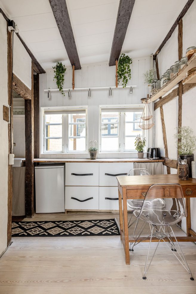 Peek inside a tiny Copenhagen loft with timbered ceilings and walls ...