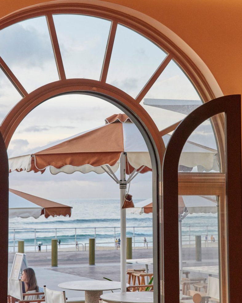The golden light of Bondi Beach floods seaside cafe Glory Days