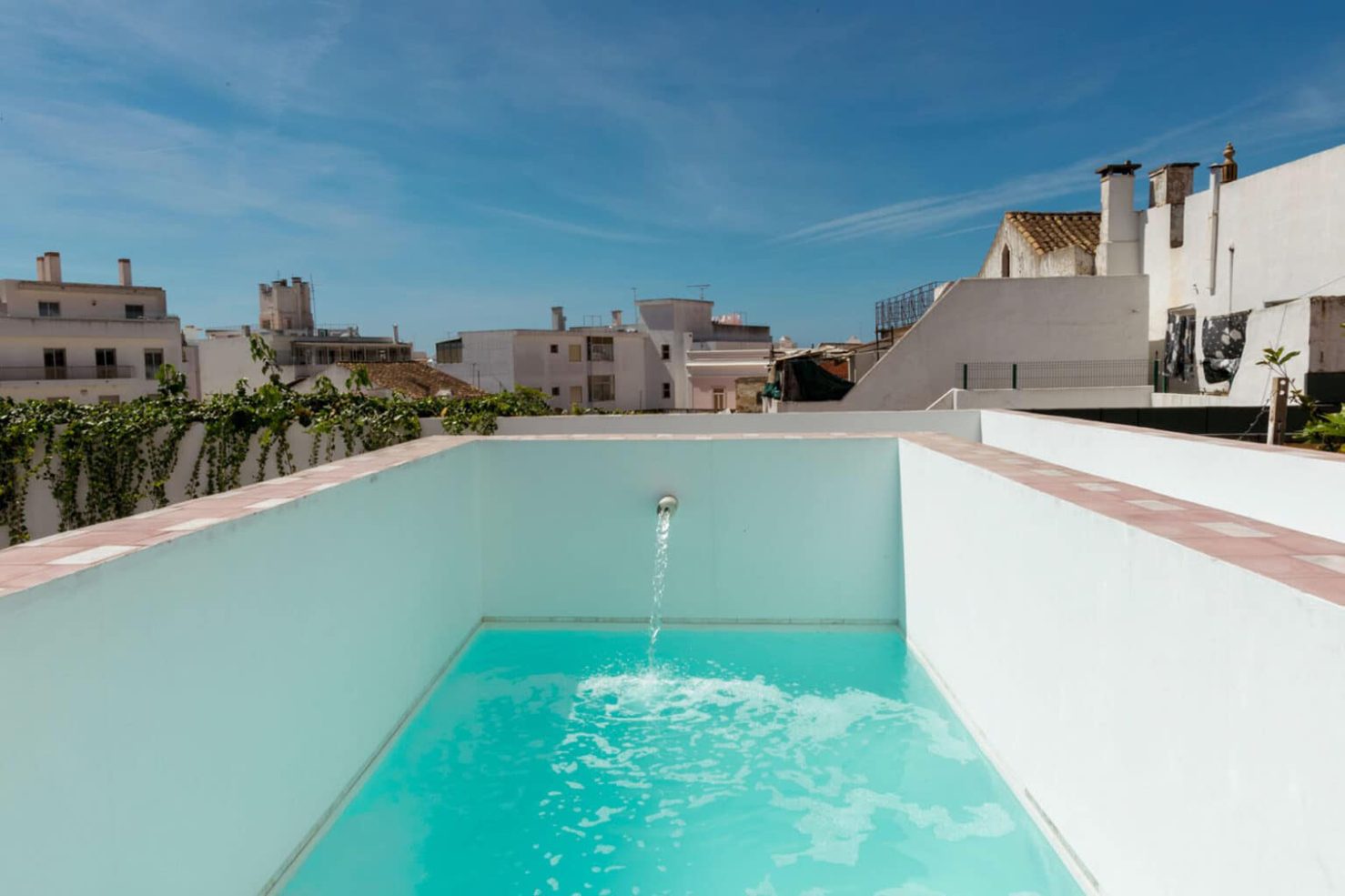 At this Faro townhouse, an extravagant facade hides minimalist ...