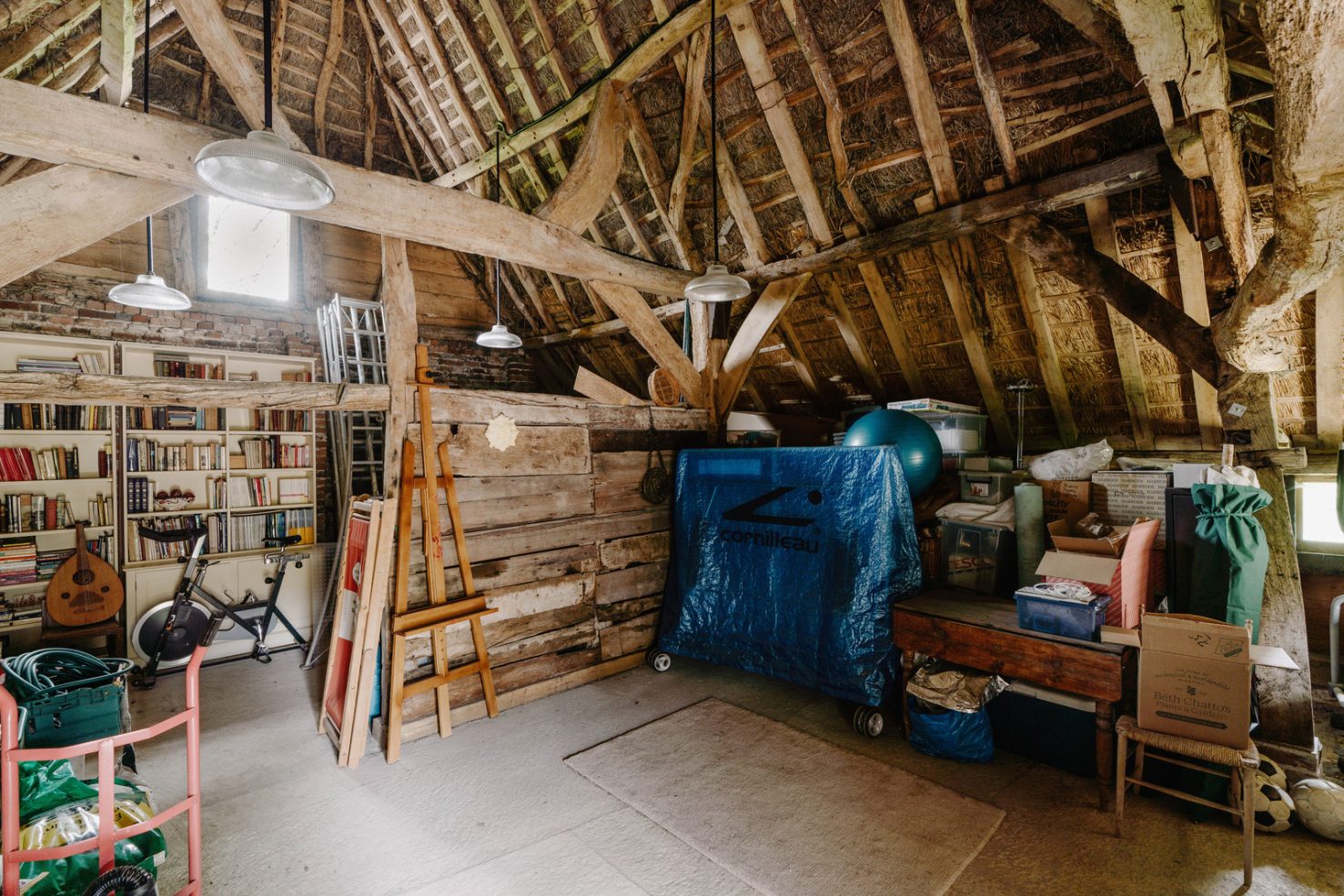 A country cottage beckons from beneath an enchanting thatched roof ...