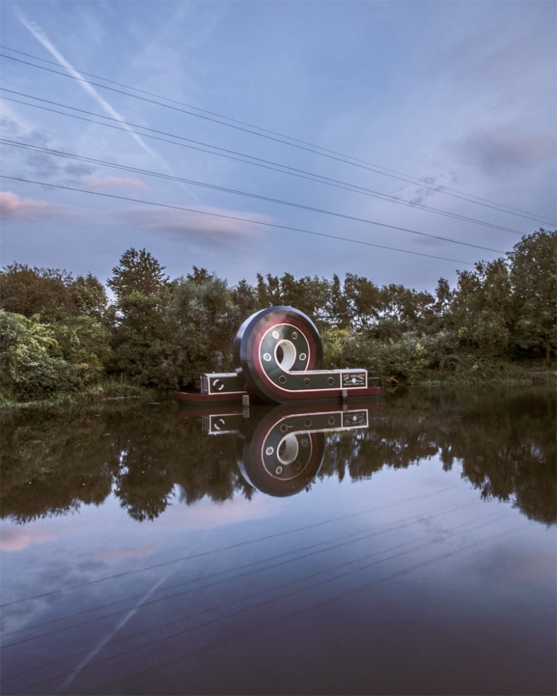 Alex Chinneck’s peculiar canal boat features a 'loop-the-loop' - The Spaces