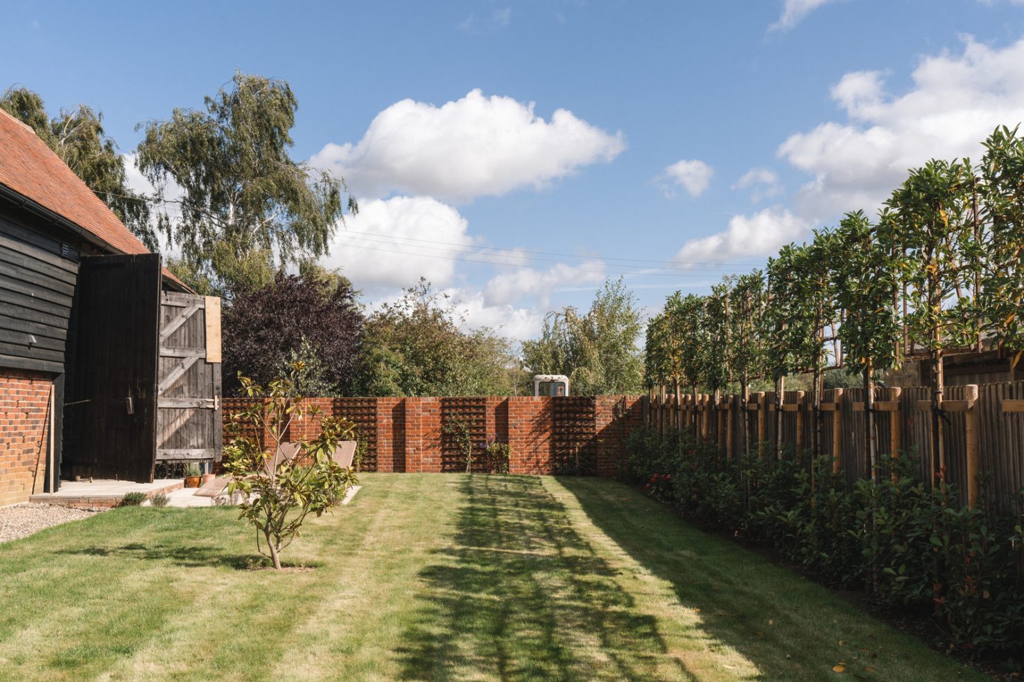 North of London, a Grade II-listed barn is reshaped through adaptive ...